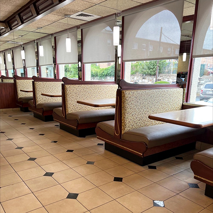 Booth seating that invites lingering conversations and second cups of that excellent house coffee.