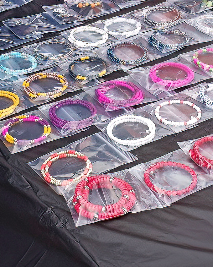 A rainbow of handcrafted bracelets lined up like edible treats. These wearable treasures showcase the artisanal spirit thriving in Durham's marketplace.