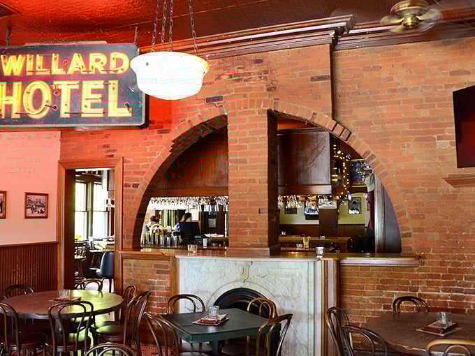 The "Willard Hotel" sign hangs as a nod to the building's history, while the arched brick doorway frames a bar that's witnessed decades of Franklin's happiest moments.