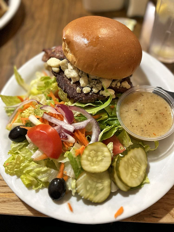 A burger that doesn't need gimmicks, just quality ingredients and proper execution. That side salad isn't an afterthought&mdash;it's balance in burger form.