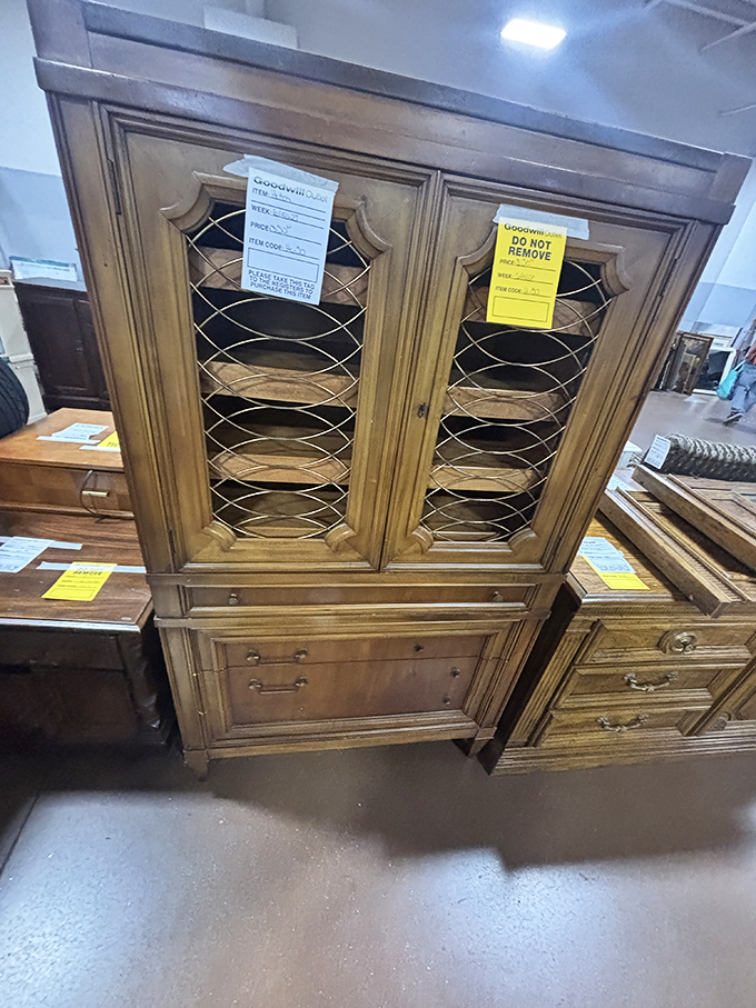 Solid wood craftsmanship that puts modern furniture to shame. This cabinet has weathered decades and still stands ready for service.