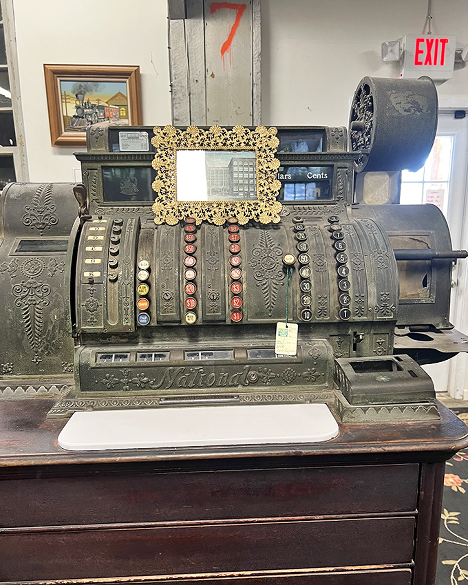This ornate cash register once rang up purchases with mechanical precision, back when shopping was ceremony, not convenience.