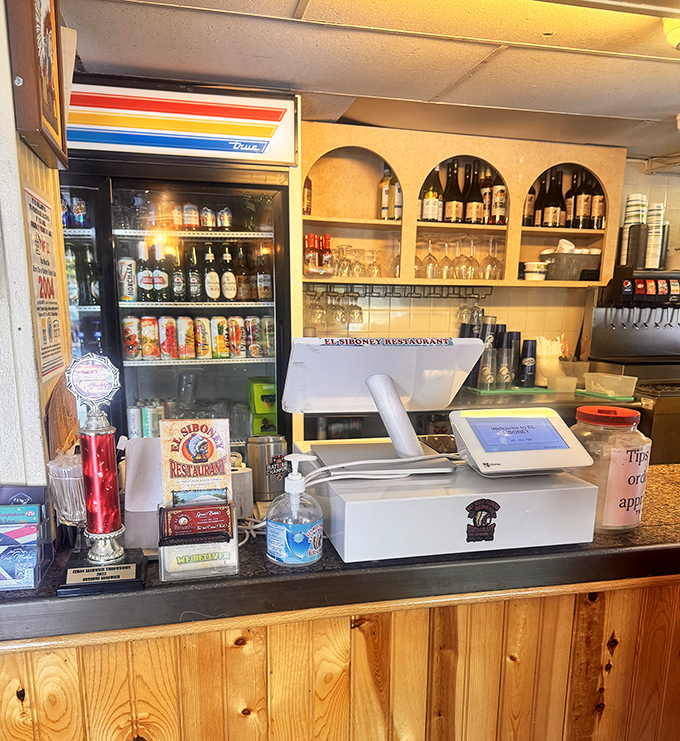 The humble cashier area where you'll reluctantly pay your bill, already planning what you'll order on your inevitable return visit.