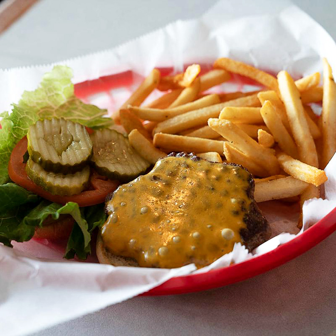 The cheeseburger&mdash;humanity's greatest invention after fire and the wheel. This beauty comes with a side of nostalgia and zero regrets.