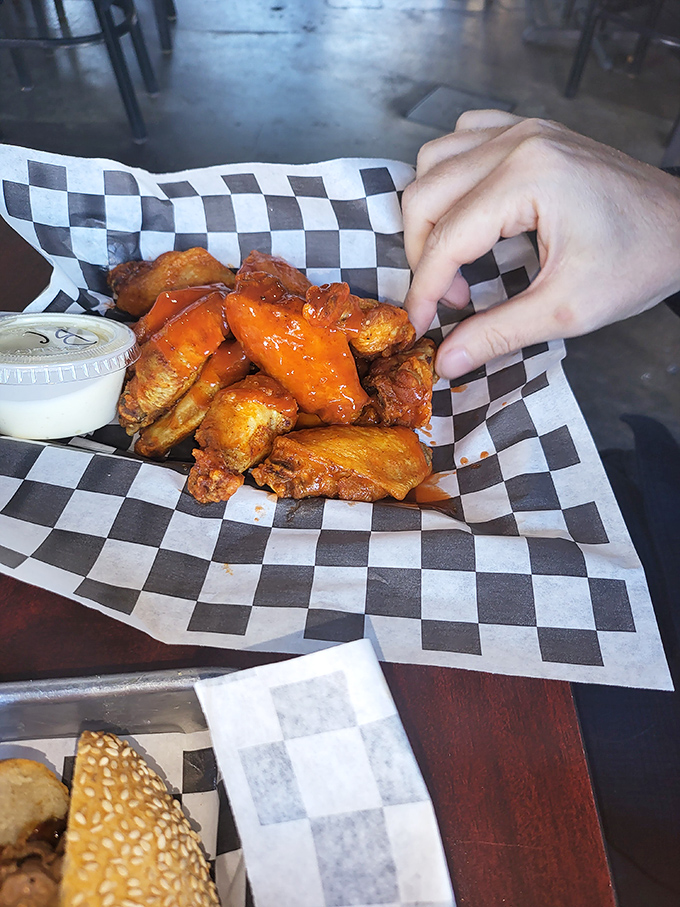 Buffalo wings glowing with that unmistakable orange hue &ndash; nature's way of saying "I'm delicious but I will absolutely stain your favorite shirt."