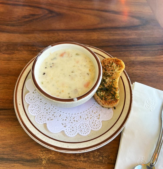Clam chowder that doesn't need to shout "New England" to prove its credentials. Creamy, hearty, and served with garlic bread for essential dipping operations.