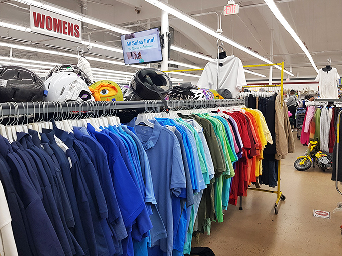 The rainbow of possibilities in the women's section &ndash; where color-coordinated clothing creates a visual feast for fashion-forward thrifters.