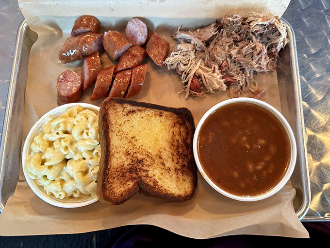 The combo platter that answers life's toughest question: "Why choose?" Sausage, pulled pork, toast, mac and cheese, and beans create a balanced diet of delicious.
