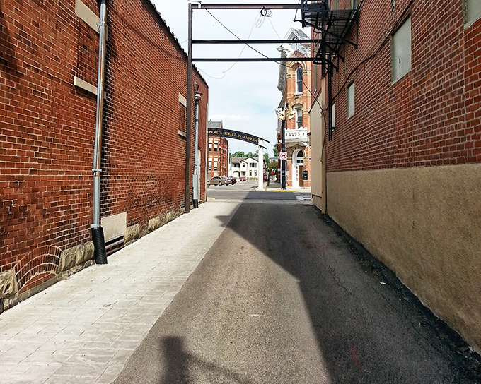Narrow alleyways between historic buildings reveal Bellefontaine's urban texture. Every small town has its secrets.