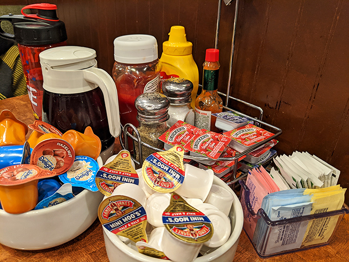 The condiment caddy&mdash;that miniature United Nations of flavor enhancement where ketchup diplomacy and sugar packet politics play out daily.