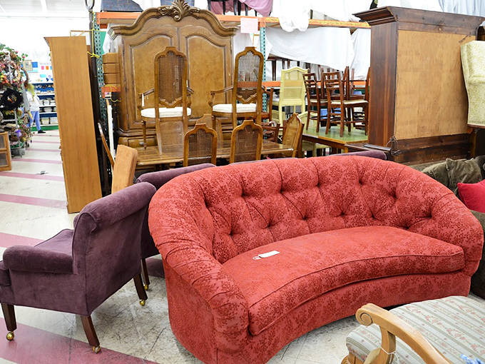 The coral loveseat demands attention like a Broadway diva &ndash; paired with that purple chair, it's the 1980s living room ensemble of your wildest dreams.