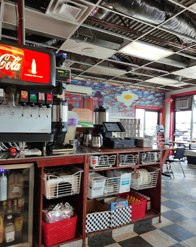 The counter setup invites solo diners to enjoy a meal without feeling alone. That Coca-Cola machine has witnessed more local news than any reporter in town.