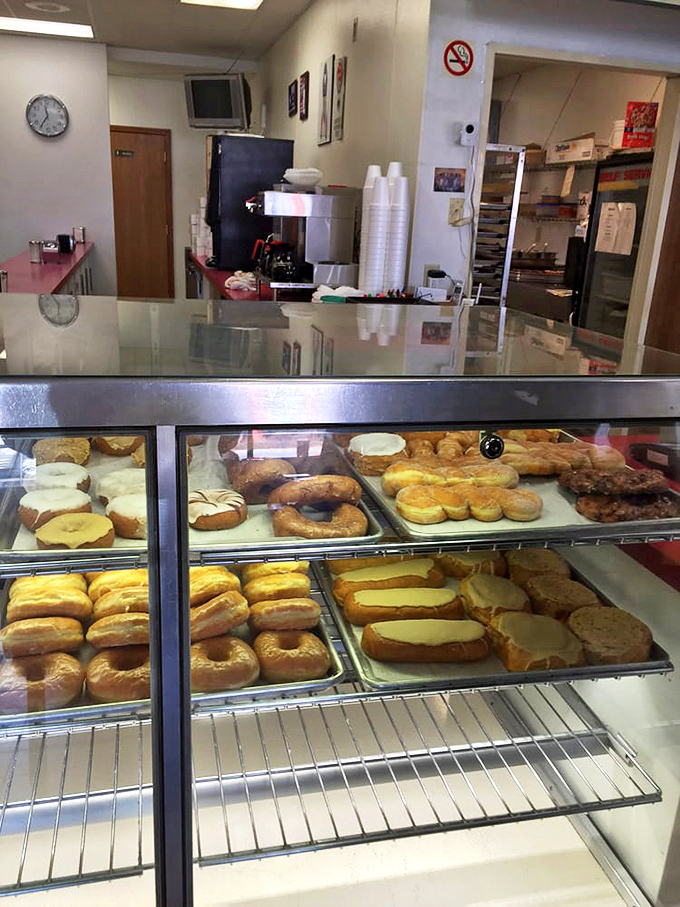 Behind this glass lies happiness measured by the dozen, where the hardest decision of your day awaits.