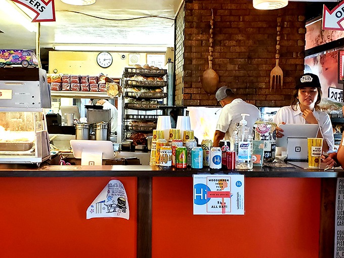 Where orders are placed and dreams come true. That orange counter has heard more "best burger ever" declarations than a Texas courtroom.