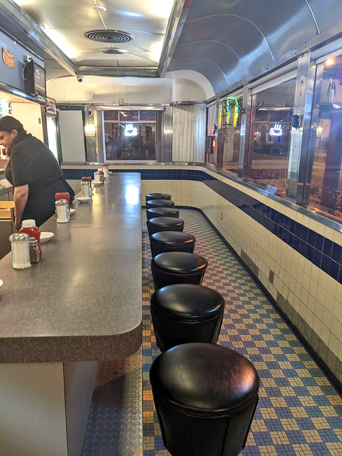 Counter seating where conversations flow as freely as the coffee, creating genuine community connections.