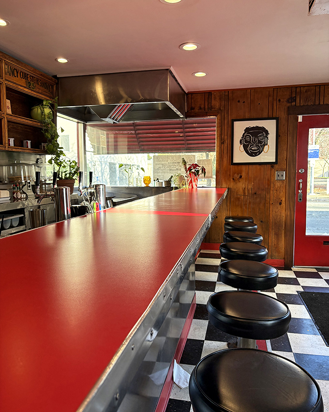 The red counter gleams like a runway for food flights of fancy. This isn't just a place to eat&mdash;it's theater where burgers are the headliners.