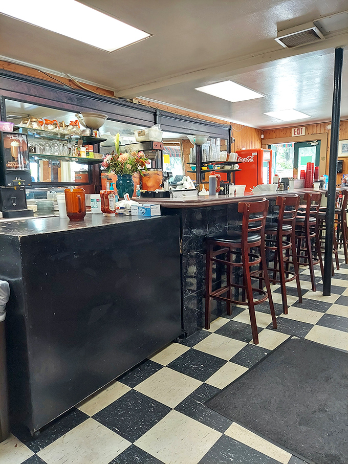 The counter seating isn't just functional—it's front-row tickets to the breakfast show, where regulars and tourists become temporary neighbors.