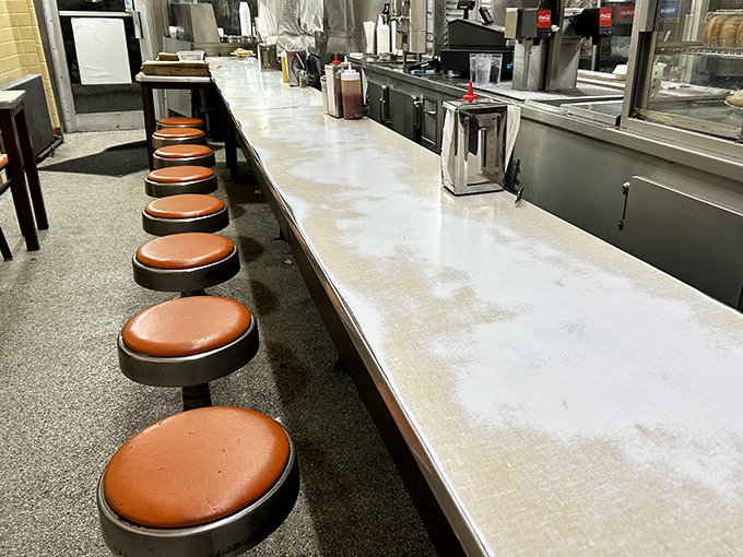 The counter seating at Lafayette isn't about comfort&mdash;it's about community. Shoulder-to-shoulder with strangers who become temporary friends over shared coney love.