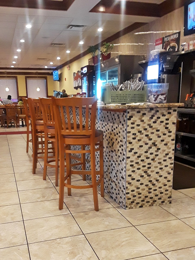 Counter seating: where solo diners become temporary neighbors and the coffee refills come at record speed.
