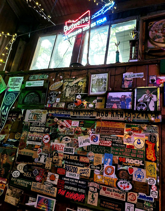 The wall of memories—where every sticker, photo, and license plate represents someone who came as a stranger and left as family.