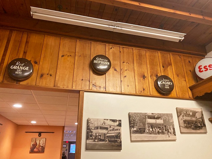 Vintage-inspired bottle caps celebrate cinema legends while black and white photos tell local stories. These walls don't just decorate&mdash;they connect diners to a shared American experience.