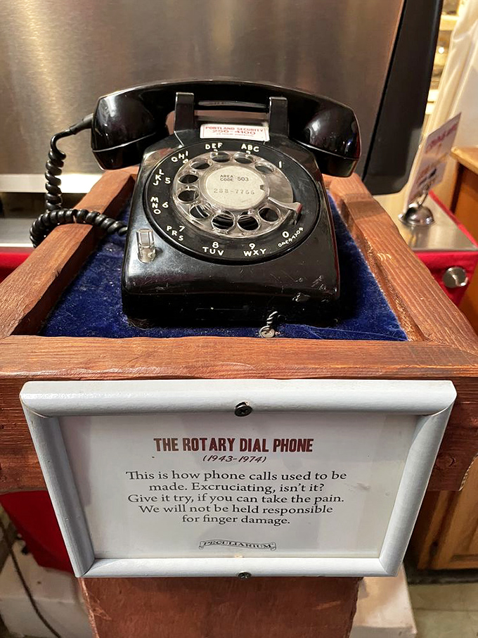 "Excruciating, isn't it?" The rotary phone display reminds us that instant gratification wasn't always a finger tap away.