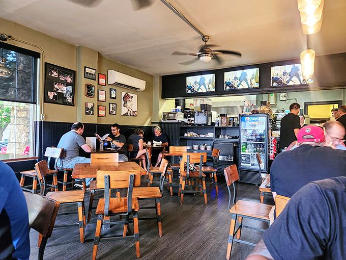 The dining room buzzes with the energy of satisfied customers, wooden chairs and tables worn to perfection by years of memorable meals.