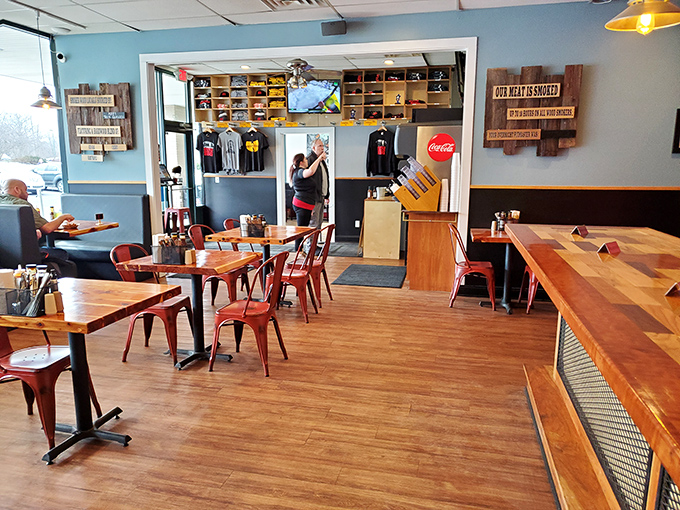 Where wooden tables and red chairs create the perfect stage for the real stars: smoked meats and hearty conversations.