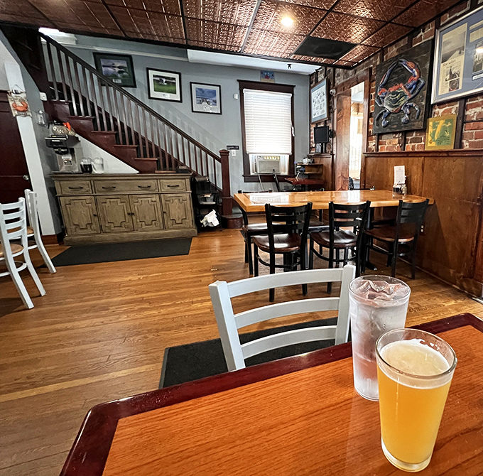 Wooden beams, copper ceiling, and cold beer&mdash;the perfect backdrop for seafood feasting. That staircase probably leads to some secret crab paradise.