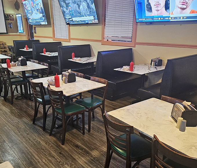 Tables arranged for both privacy and community&mdash;the perfect balance for those "I want to be alone but not really alone" dining moments. Red squeeze bottles stand ready for action. 