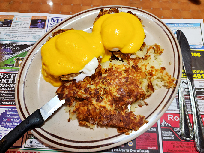 Eggs Benedict with hollandaise so yellow it could brighten even Monday mornings. Those hash browns are the unsung heroes here.