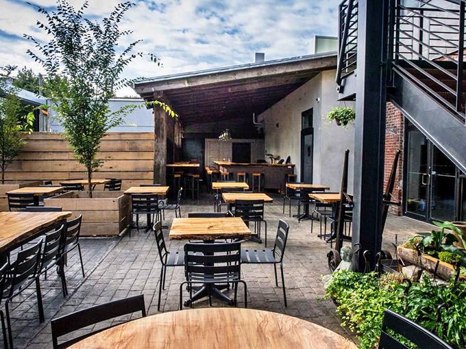 The outdoor patio&mdash;where summer afternoons turn into evening conversations. Urban dining with just enough greenery to make you forget you're in the city. 