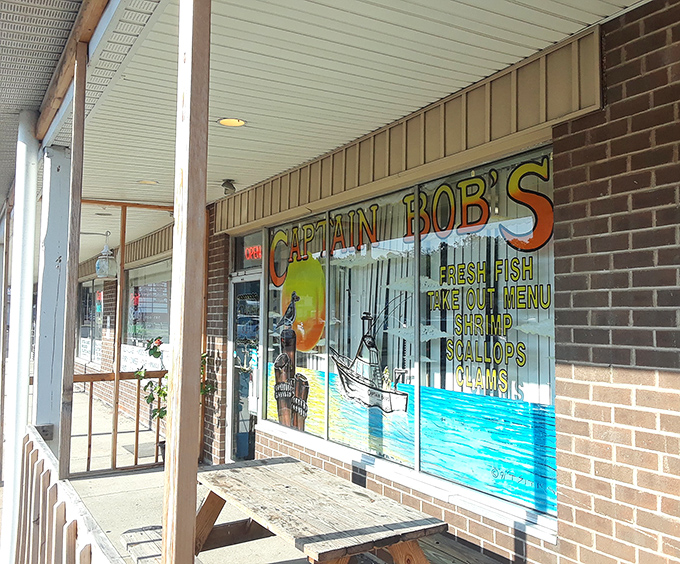The storefront features hand-painted coastal scenes on the windows. A visual promise of seafood delights that await inside.