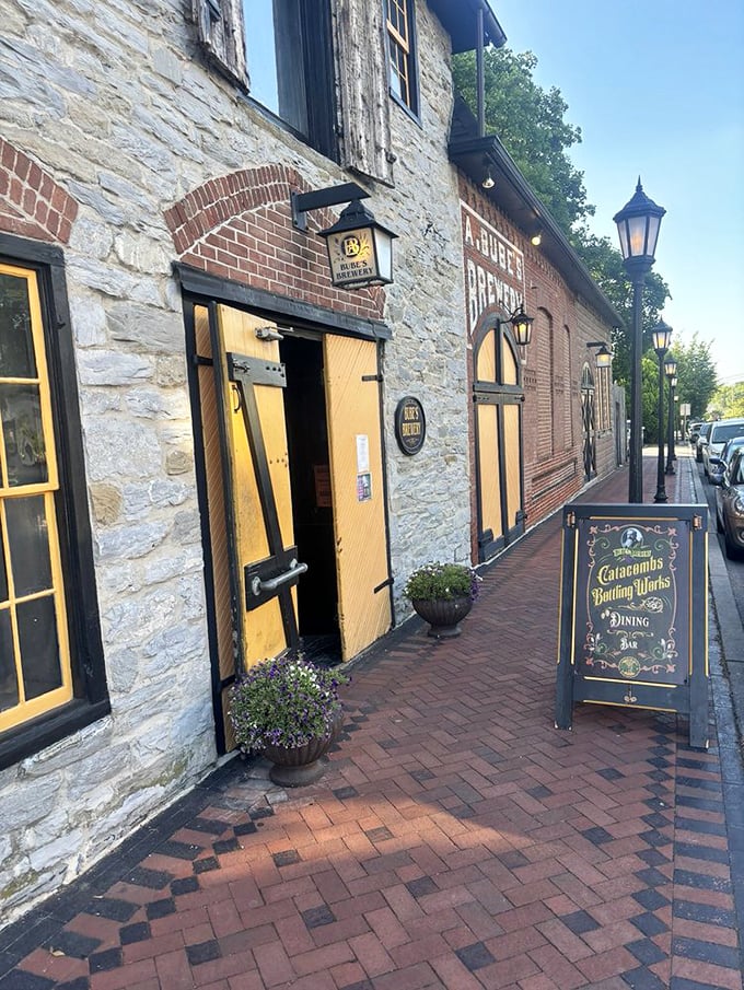 The entrance beckons with historic charm&mdash;yellow doors against weathered stone promising experiences you won't find at your neighborhood chain restaurant.