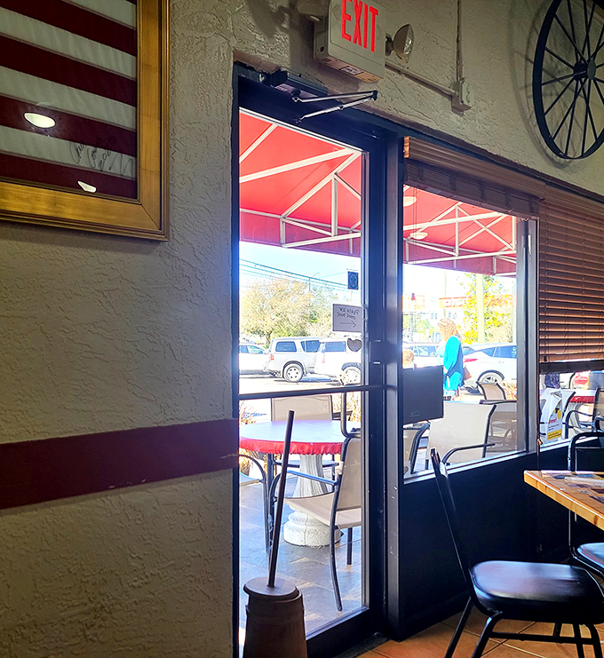 Sunlight streams through the exit, but who's leaving when there's still coffee to drink? The outdoor seating beckons for those who prefer fresh air with their fresh biscuits.