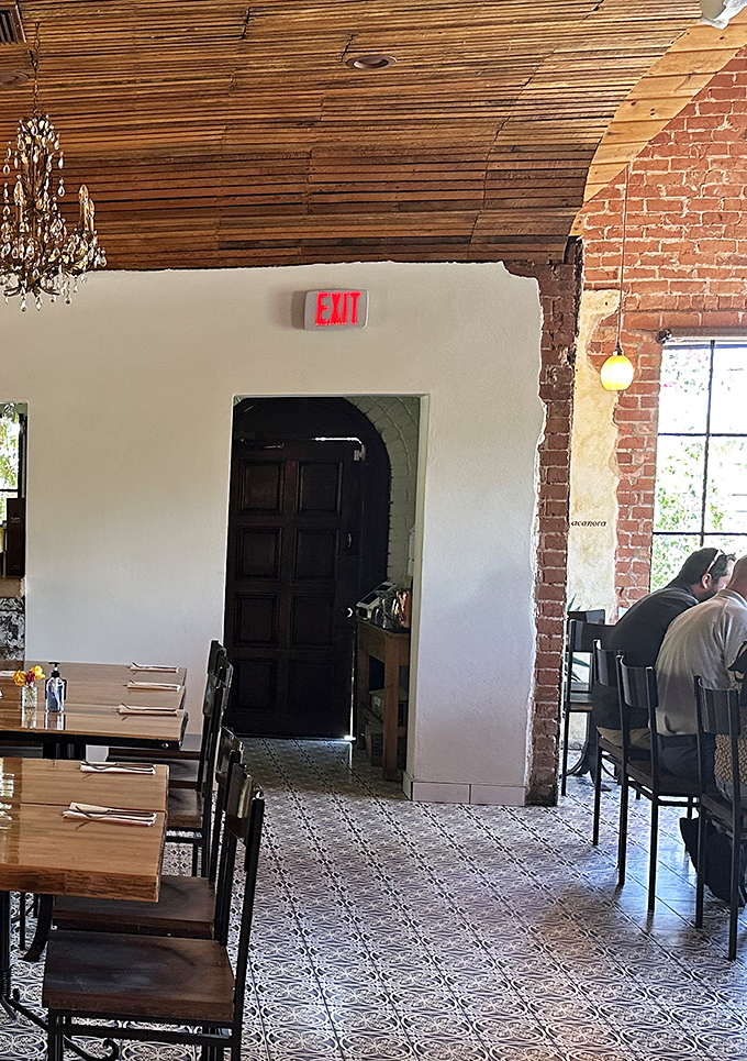 Architectural details like wooden ceiling beams and exposed brick arches remind you that good design, like good food, never goes out of style.