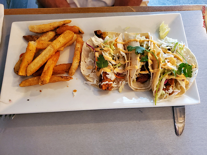 Soft tortillas cradle flaky fish and fresh toppings in this delightful twist on seaside dining classics.