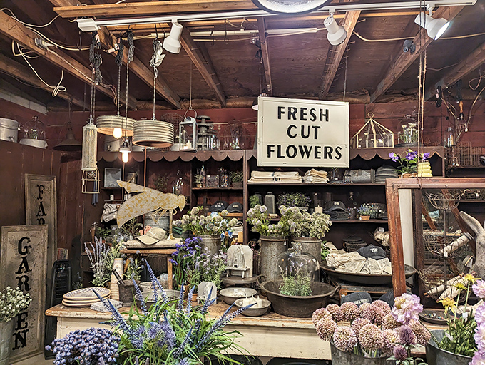 A flower stand that feels like stepping into a cottage garden. Fresh blooms and vintage containers create an Instagram moment without filters.