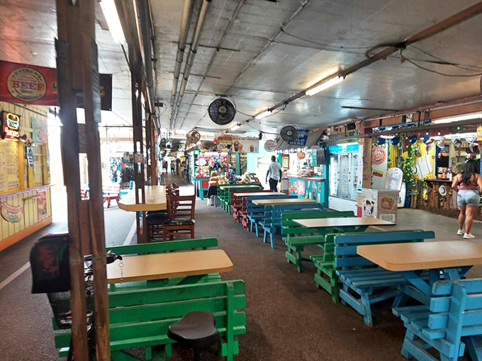 The food court's colorful benches invite weary shoppers to rest their feet and refuel before the next round of bargain hunting.
