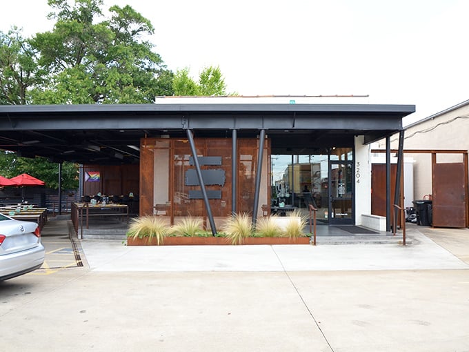 The modern exterior promises something special inside, and this Richmond gem delivers on every architectural and culinary promise made.