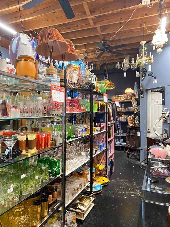 A rainbow of glassware catches the light, each colorful vessel holding memories of dinner parties and special occasions long past.