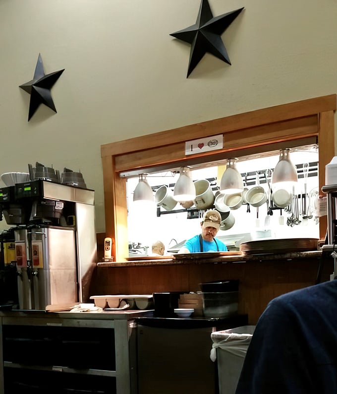 A glimpse into the kitchen reveals the wizard behind the curtain, crafting comfort food magic that keeps locals coming back for decades.