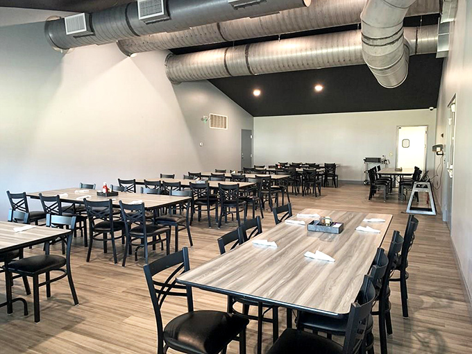 Modern meets homestyle in this dining area where exposed ductwork watches over tables that have hosted countless family gatherings.