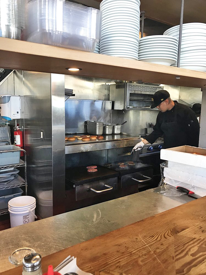 Kitchen ballet at its finest – where burger patties meet fire on that legendary crossfire broiler. Dinner and a show, all in one.