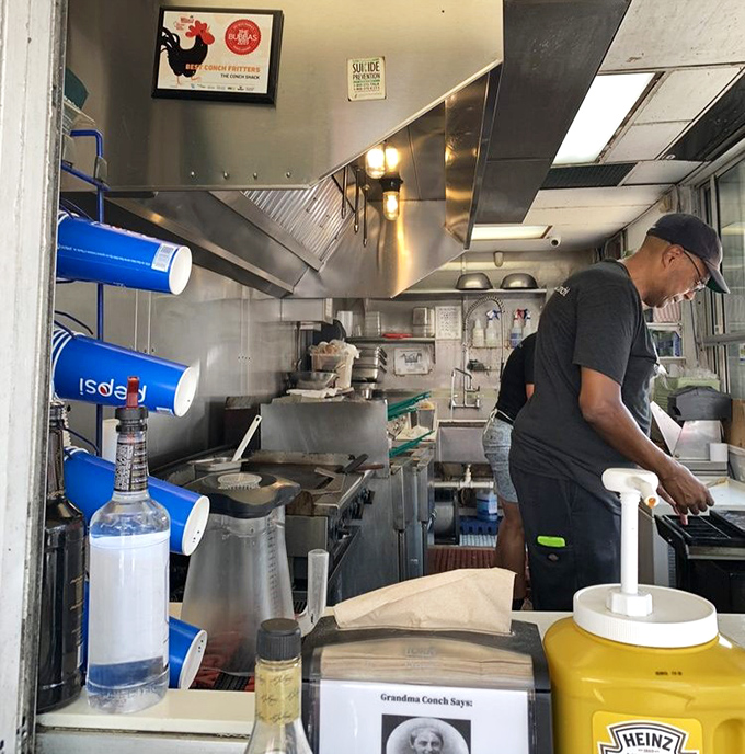 Behind every great conch fritter is a kitchen that knows exactly what it's doing. The real action happens behind these stainless steel curtains.