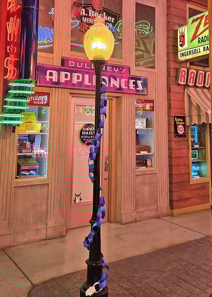 Even the lamp posts tell a story here. This vintage street light with its decorative spiral stands guard outside Dulbey's Appliances like a sentinel of simpler times.