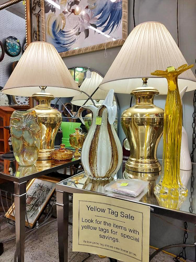 Gleaming brass lamps await their second act in someone's living room. That yellow Murano-style giraffe is the statement piece you never knew you needed.