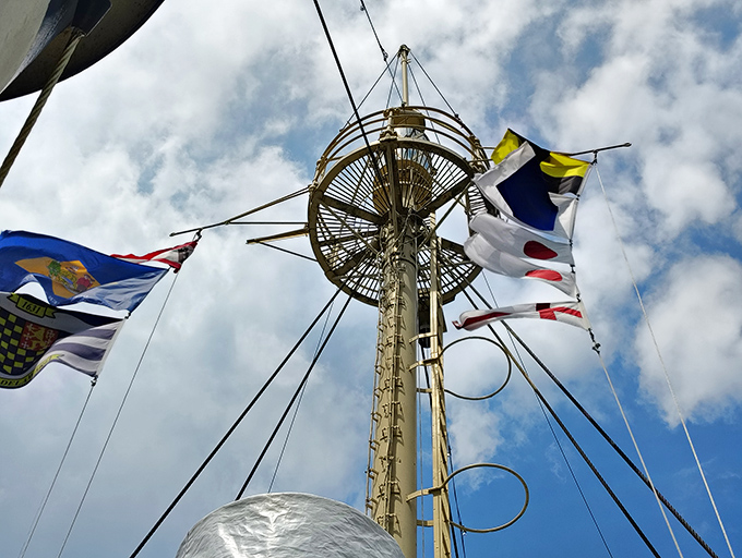 Looking up at the mast's crow's nest and colorful signal flags, you can almost hear the wind whistling through the rigging on stormy nights.