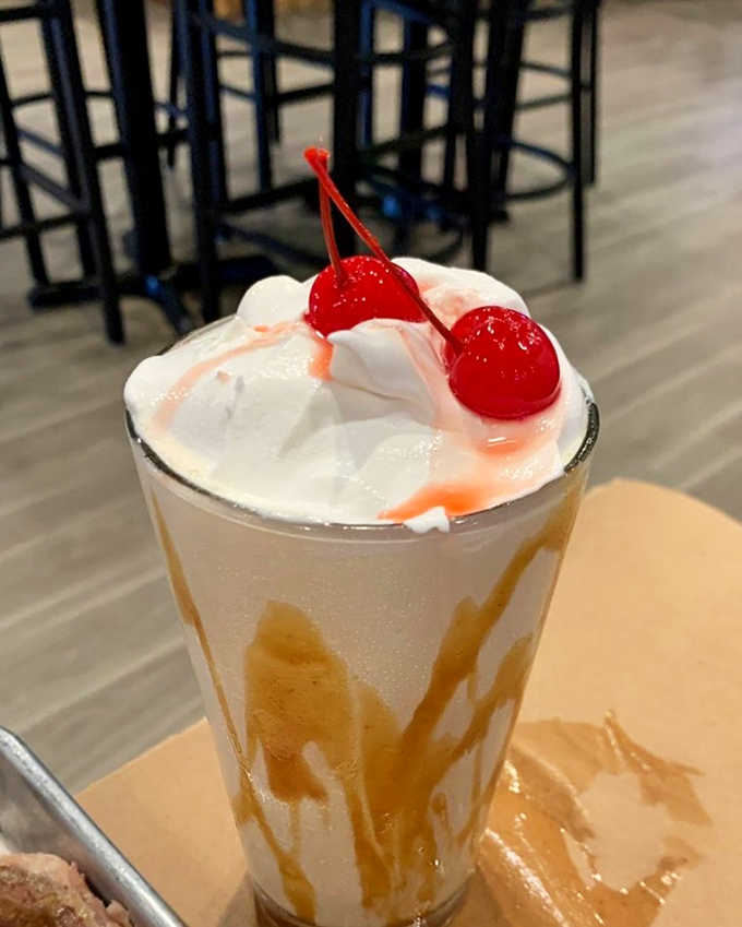 Dessert in a glass: a creamy milkshake topped with whipped cream and cherries proves that Jimmy Bear's sweet side is just as impressive as its savory one.