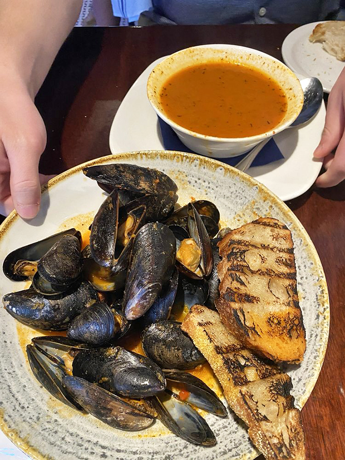 These mussels aren't just shellfish&mdash;they're little black submarines delivering payloads of briny-sweet flavor, ready to be sopped up with that perfect grilled bread.